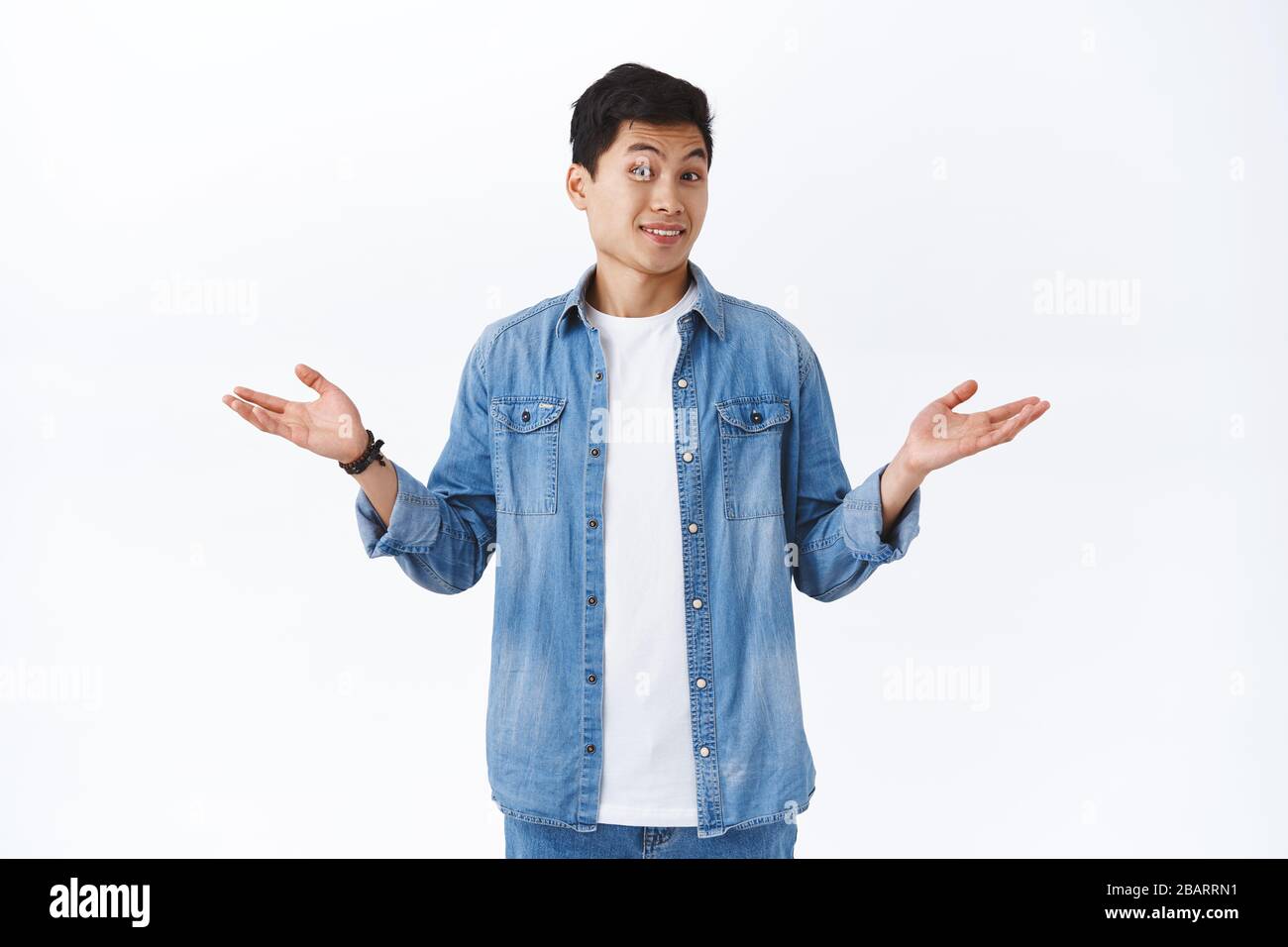 Portrait of clueless handsome asian young man cant answer, have no idea ...