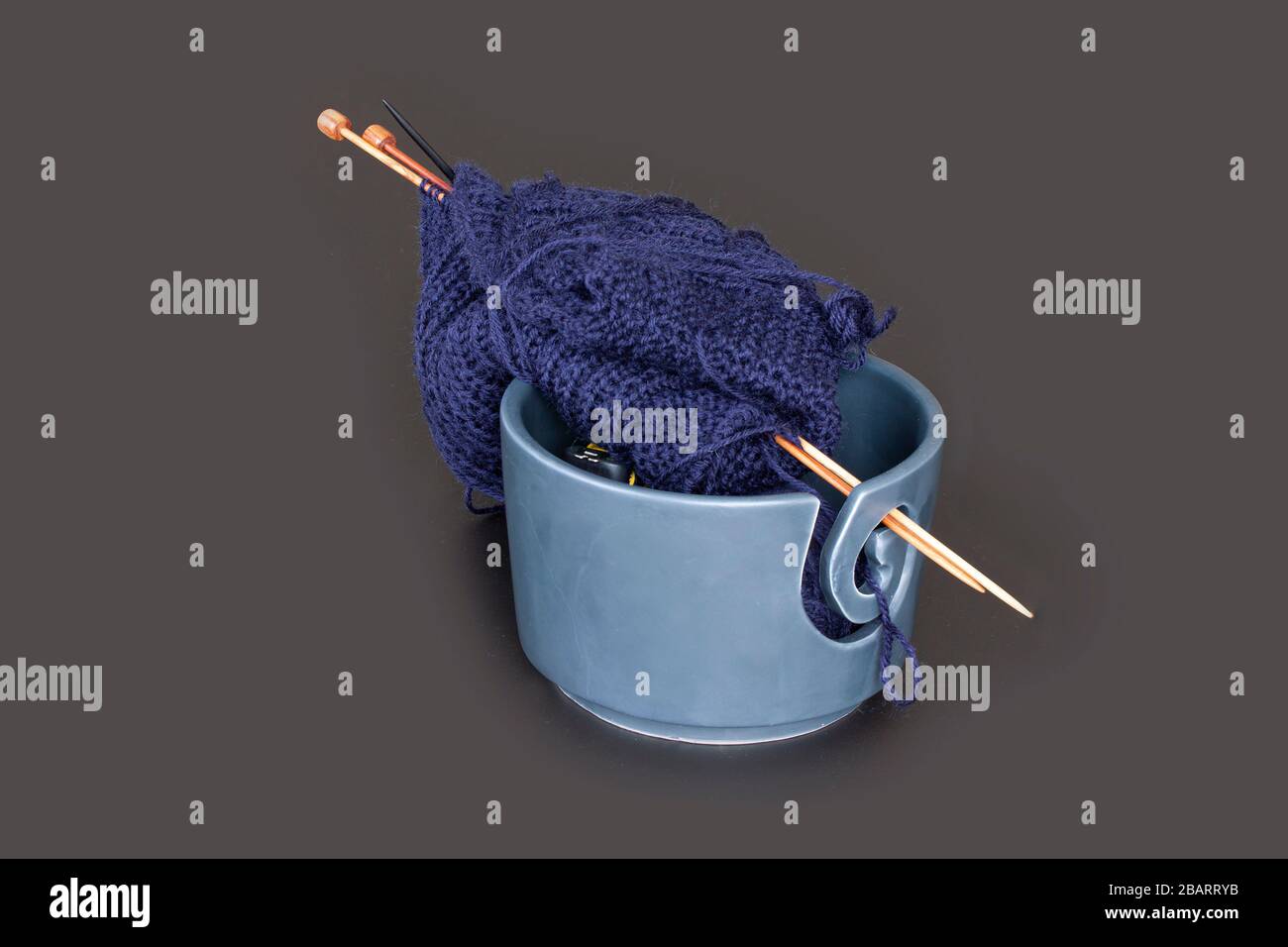 Knitting tools, ball of wool yarn for knitting and wooden needles. Blue ...