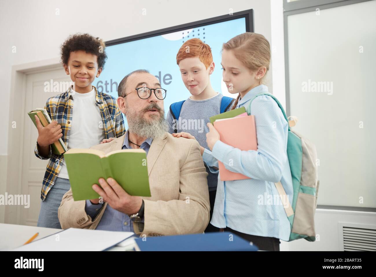 Low angle view at multi-ethnic group of children standing around ...