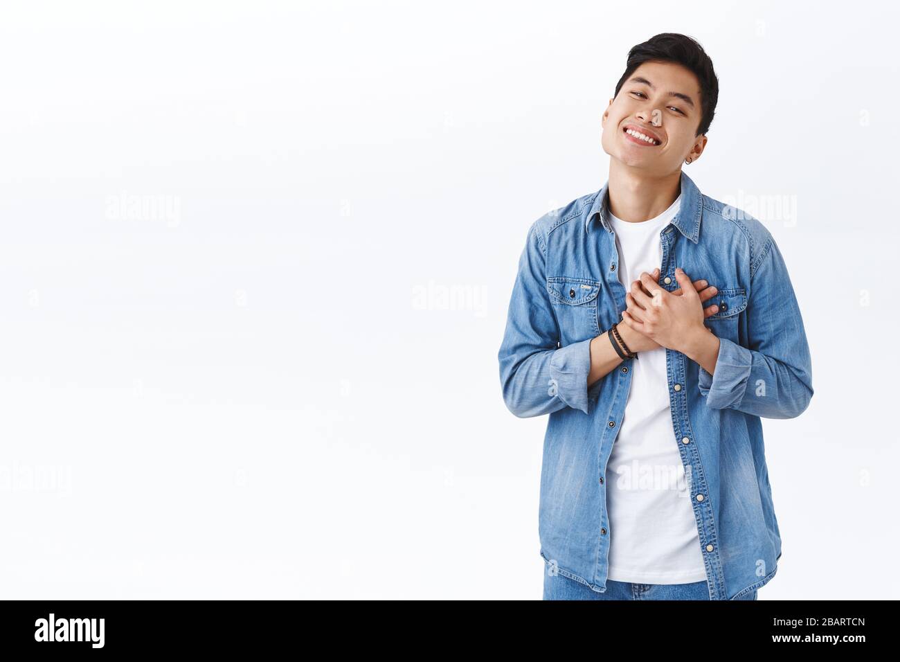 Portrait of touched handsome taiwanese man in love, express sympathy ...