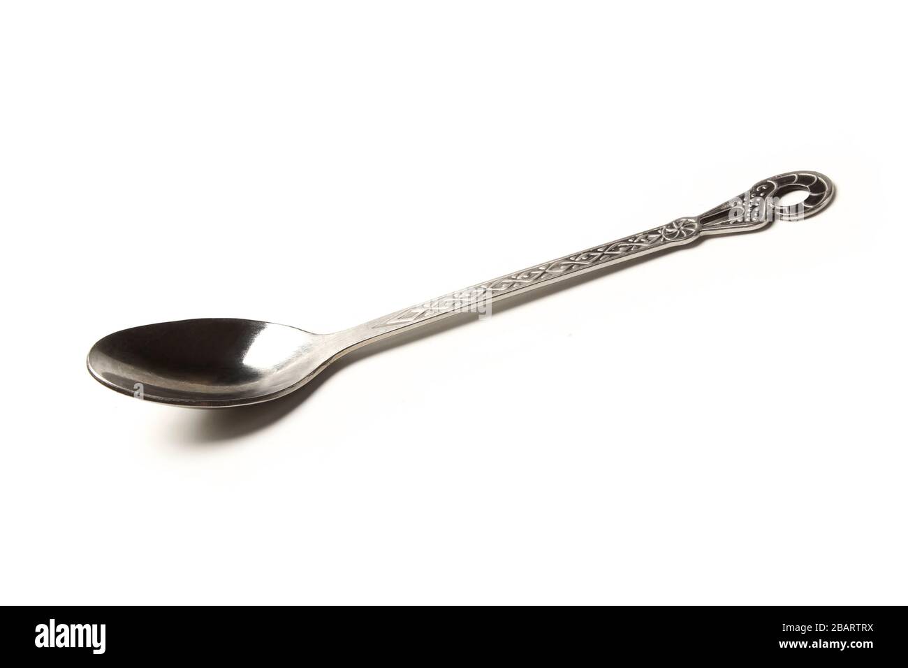 Metal teaspoon isolated on white background Stock Photo - Alamy