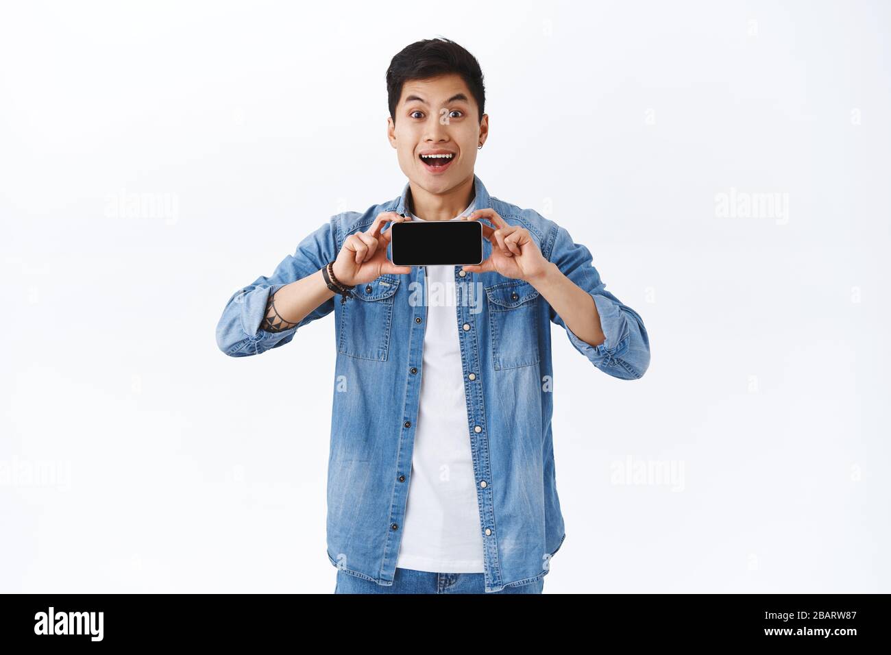 Technology, online lifestyle concept. Look at this. Astonished and ...