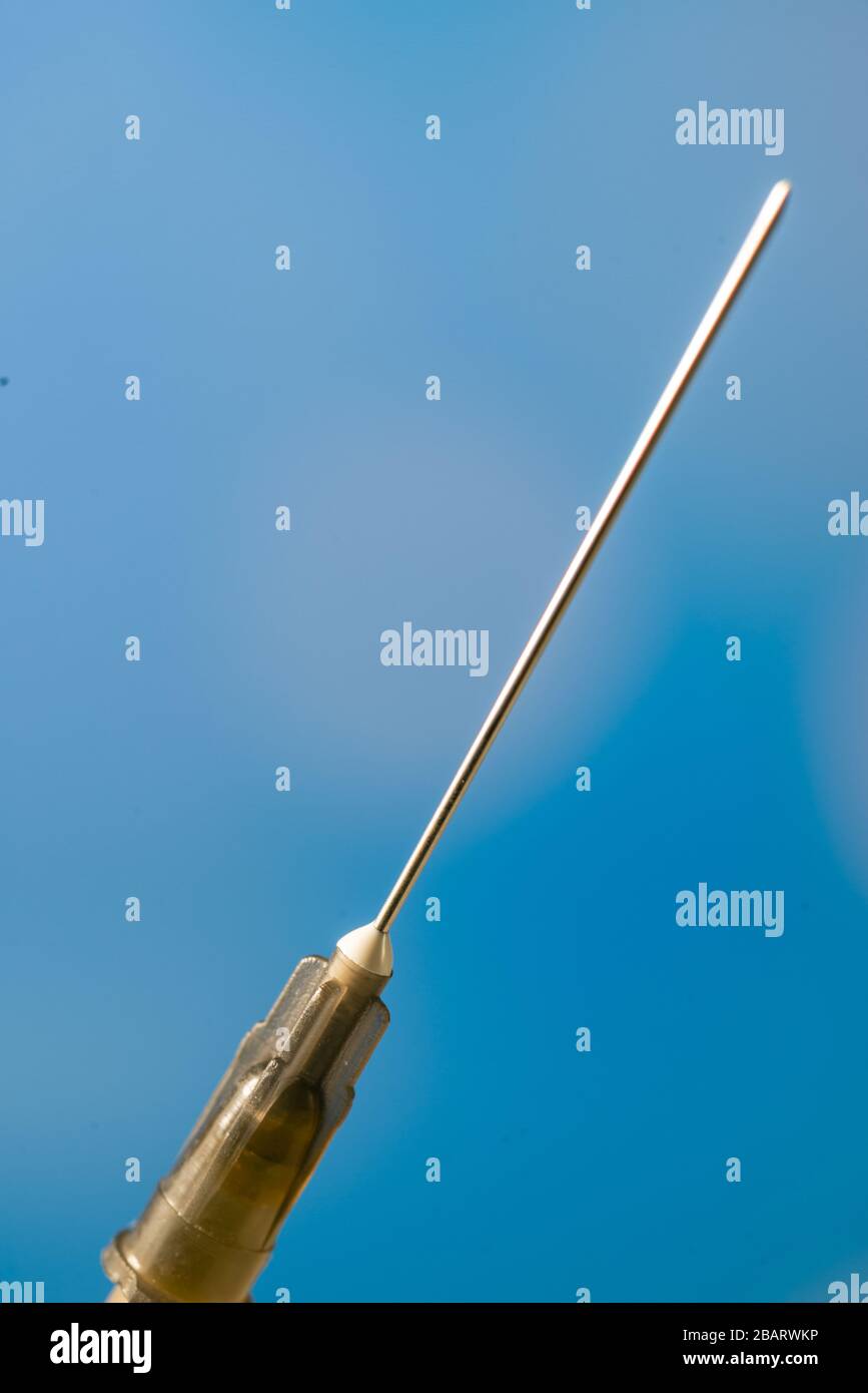 Medical syringe needle close-up with space for signature Stock Photo ...