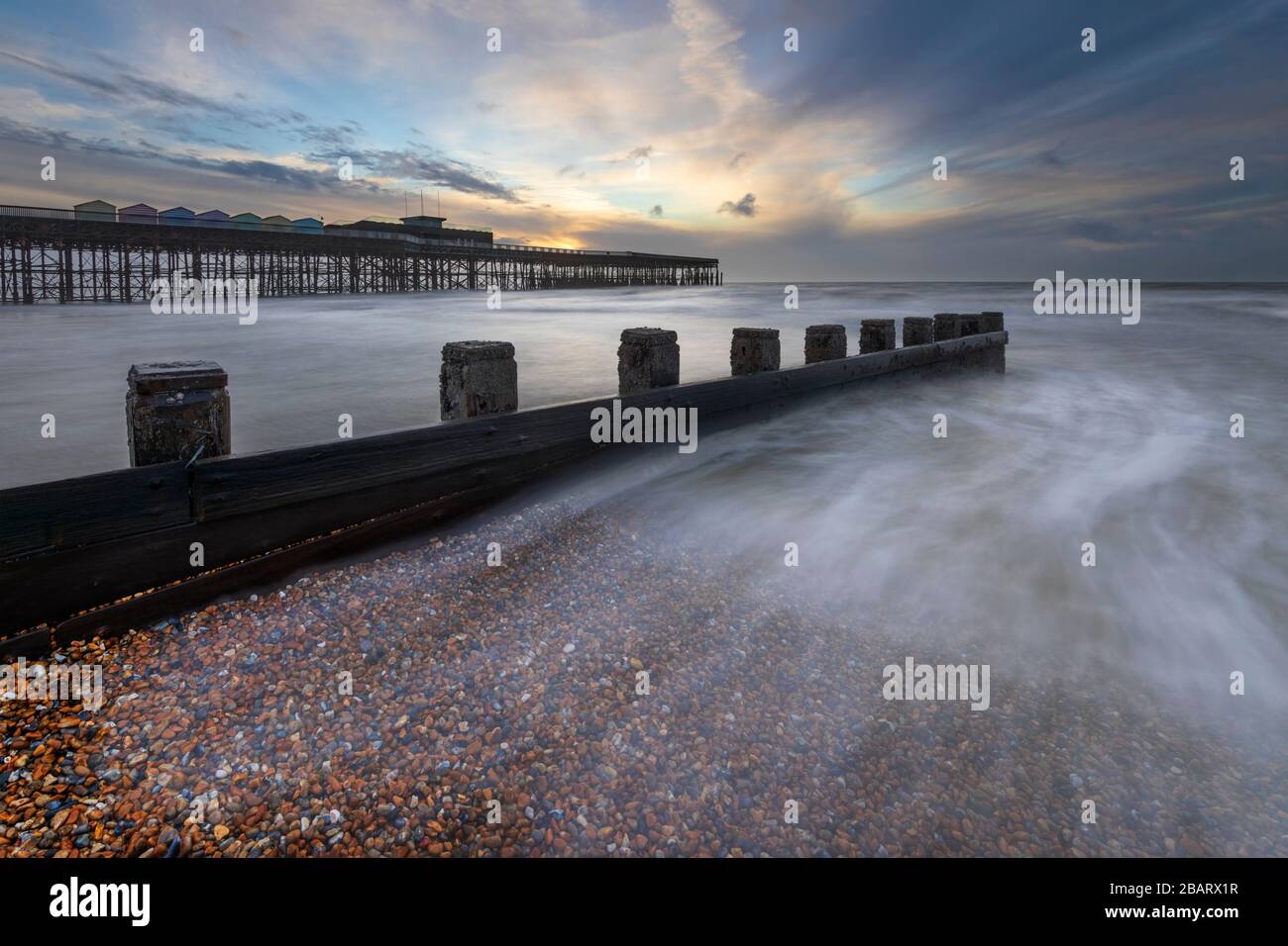 View of the English channel sea with long exposure blur and Hastings ...