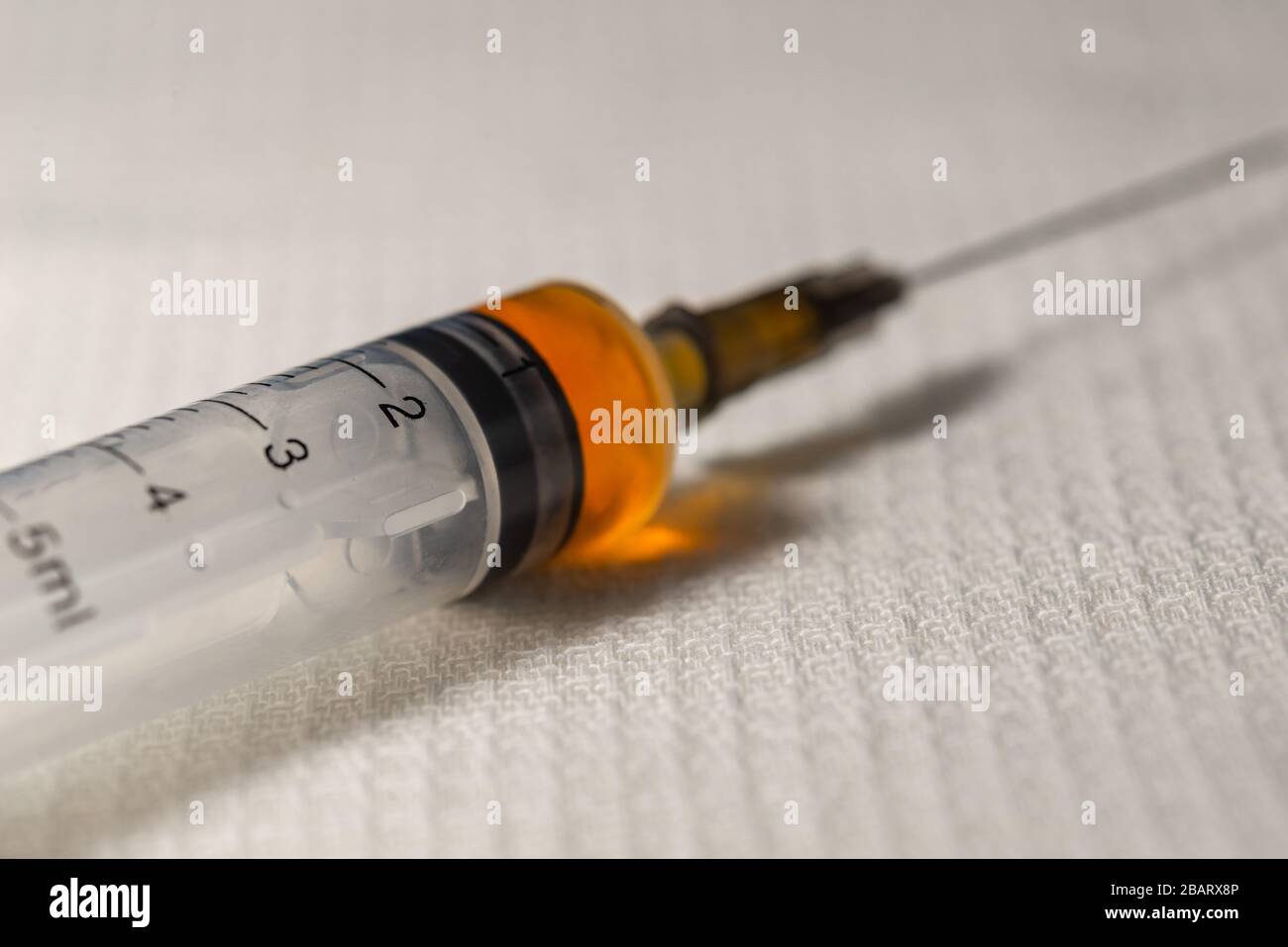 Medical syringe needle close-up with space for signature Stock Photo ...