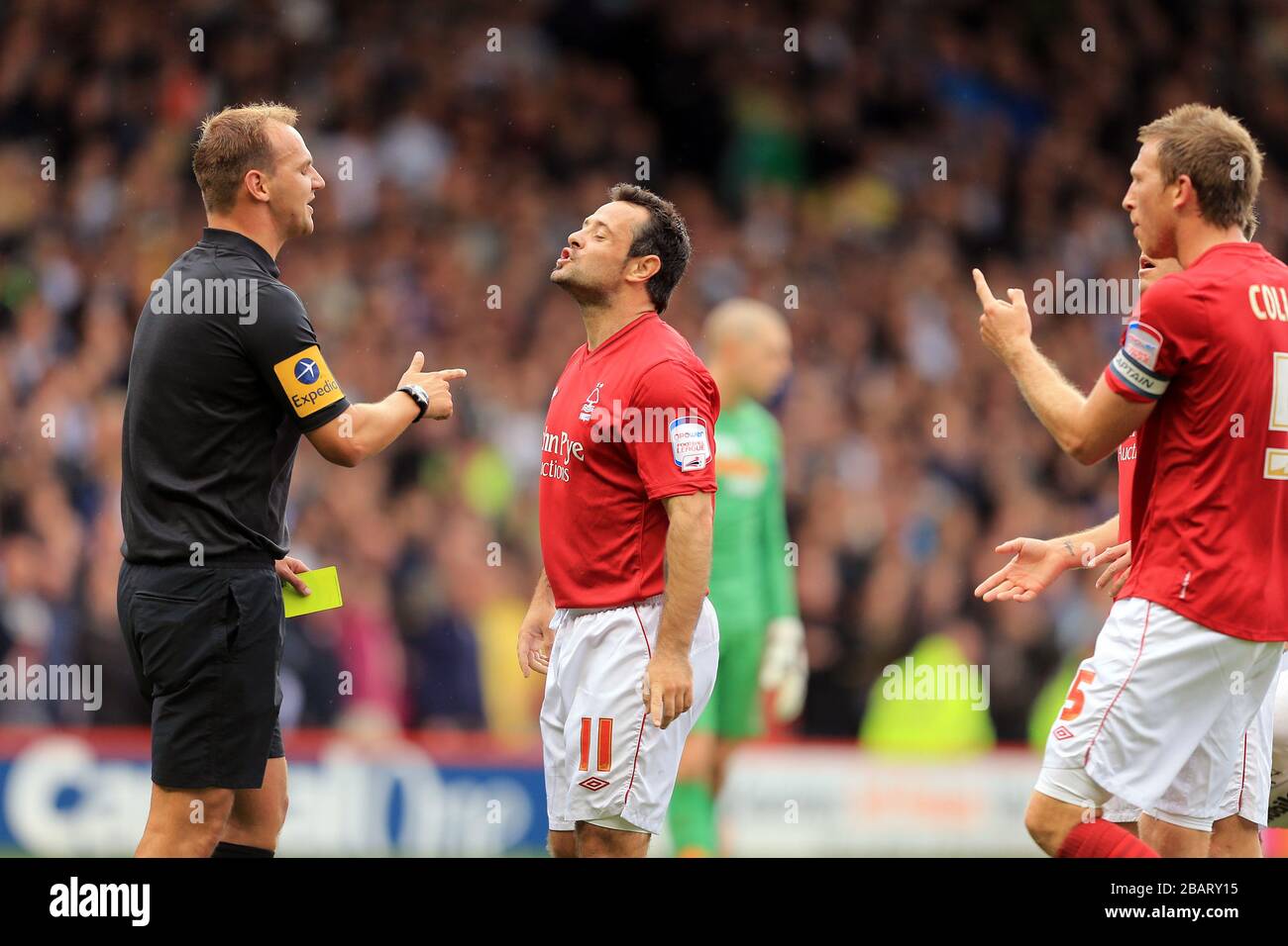 Nottingham Forest's Andy Reid (centre) complains to referee Rob Madley ...