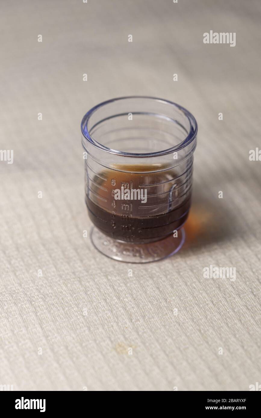 medical syrup in spoon Stock Photo - Alamy