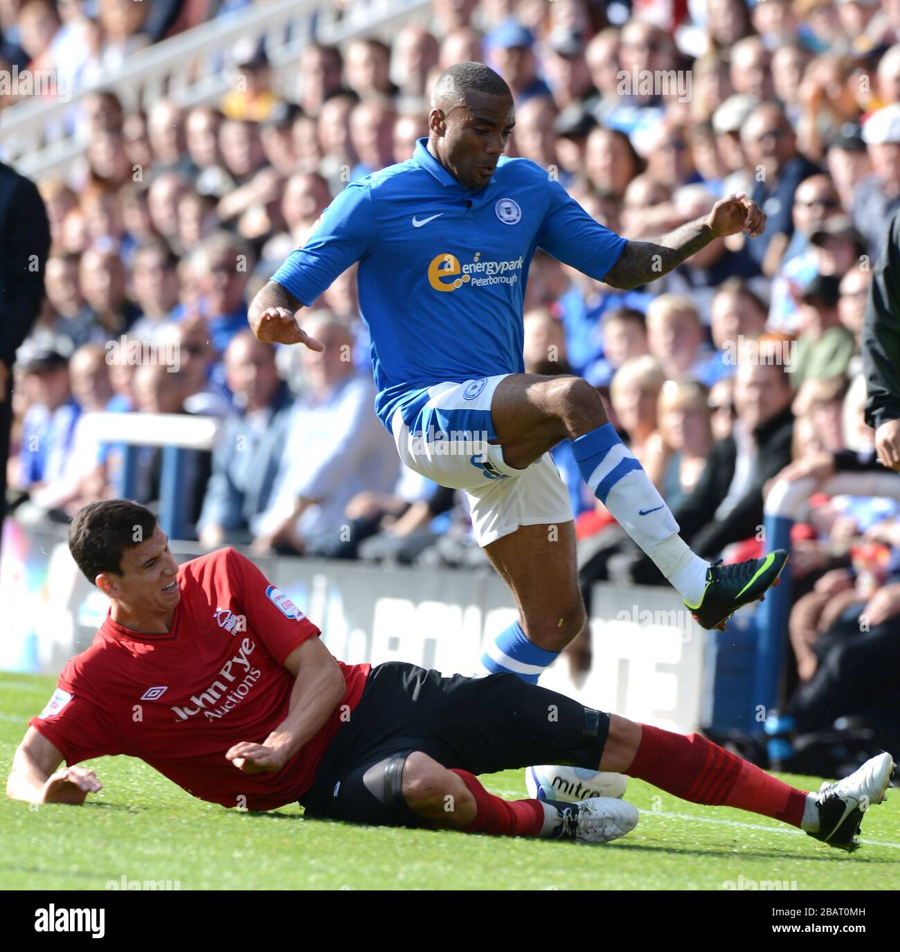 Peterborough United's Emile Sinclair is tackled by Nottingham Forest's ...