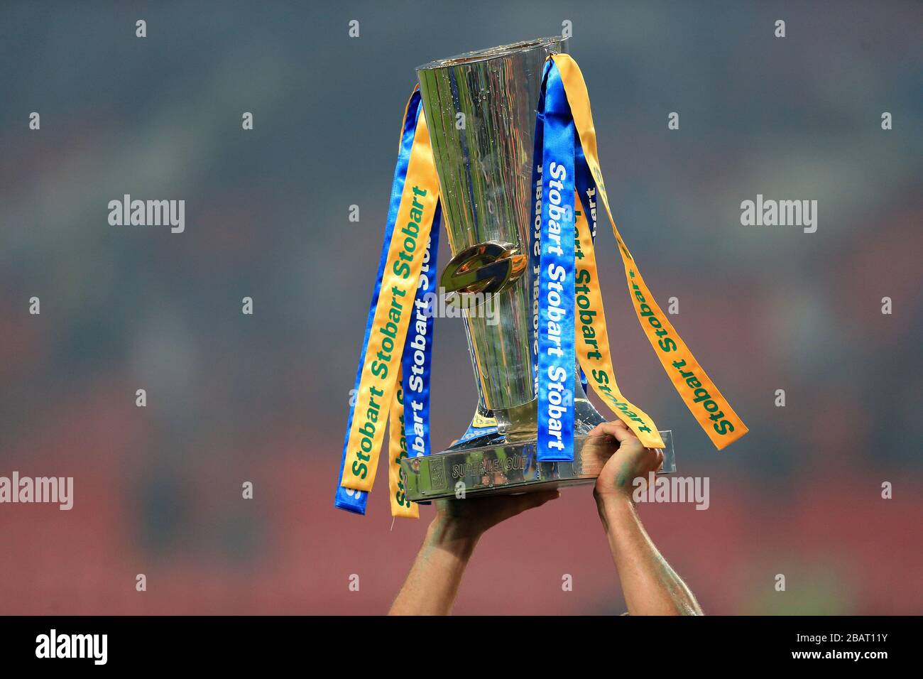 Leeds Rhinos players lift the grand final trophy Stock Photo - Alamy