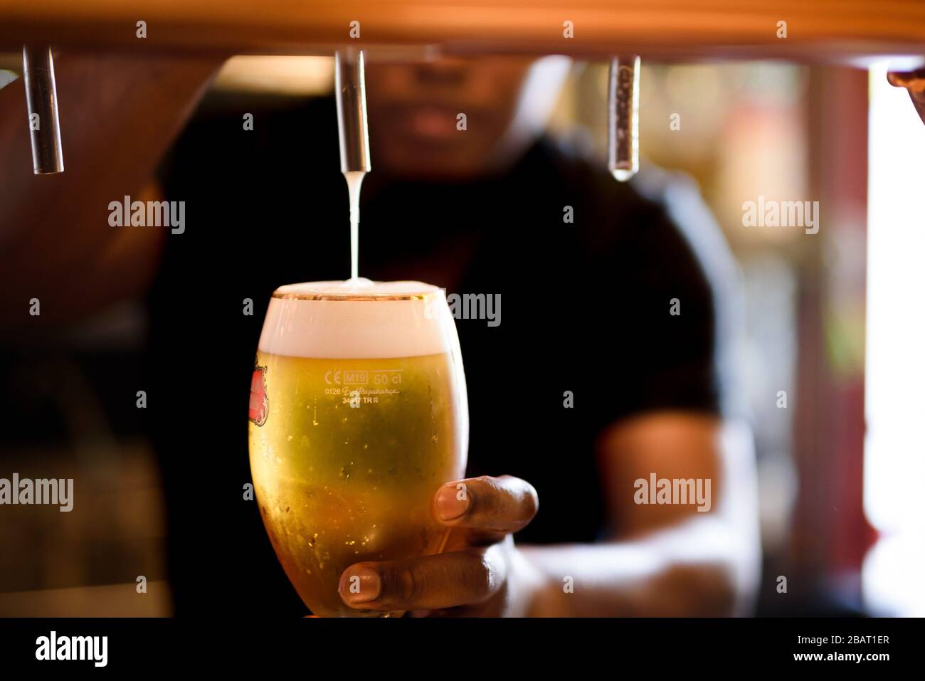 a nice cold beer from a tap Stock Photo - Alamy
