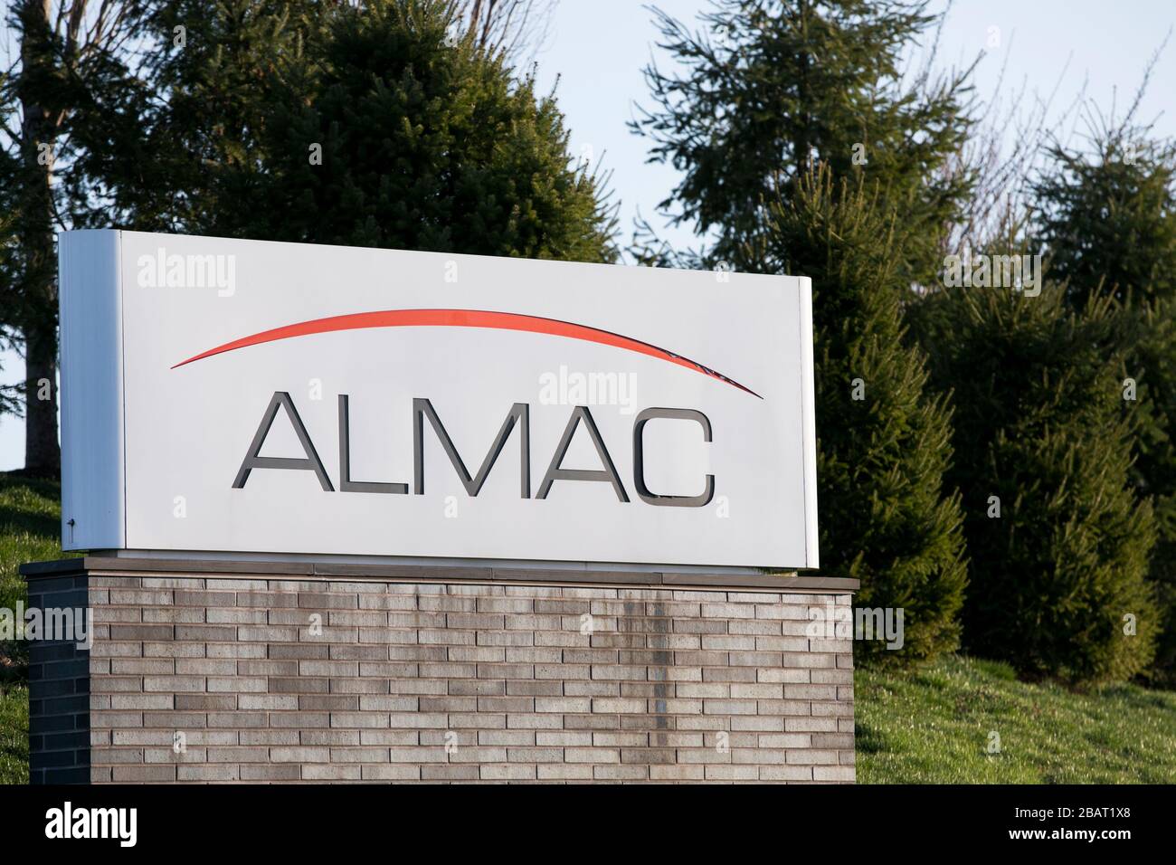 A logo sign outside of a facility occupied by Almac in Souderton ...
