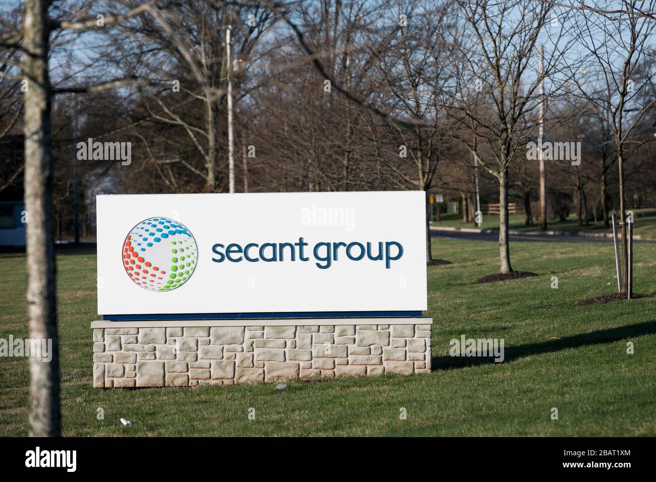 A logo sign outside of a facility occupied by the Secant Group in ...