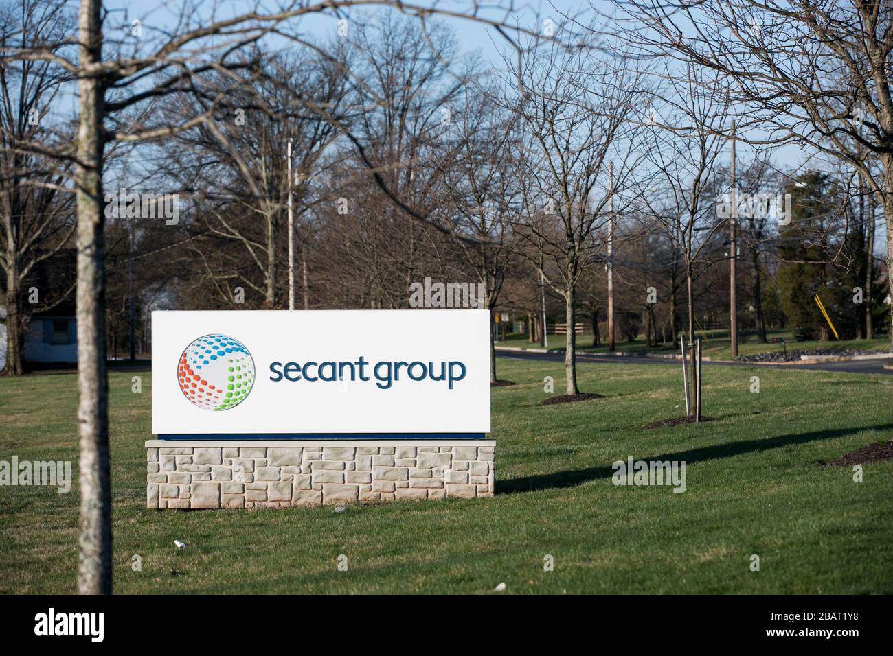 A logo sign outside of a facility occupied by the Secant Group in ...