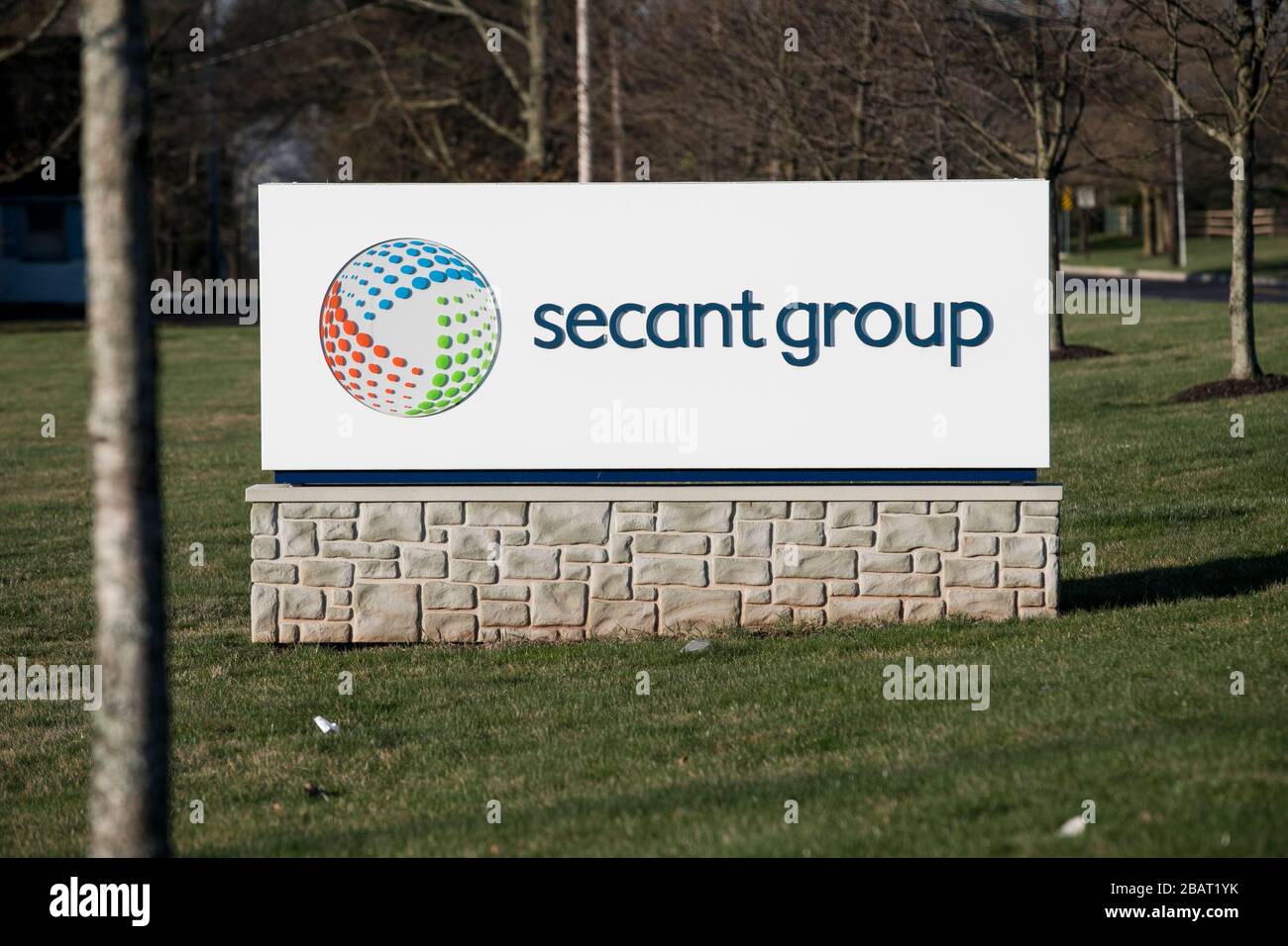 A logo sign outside of a facility occupied by the Secant Group in ...