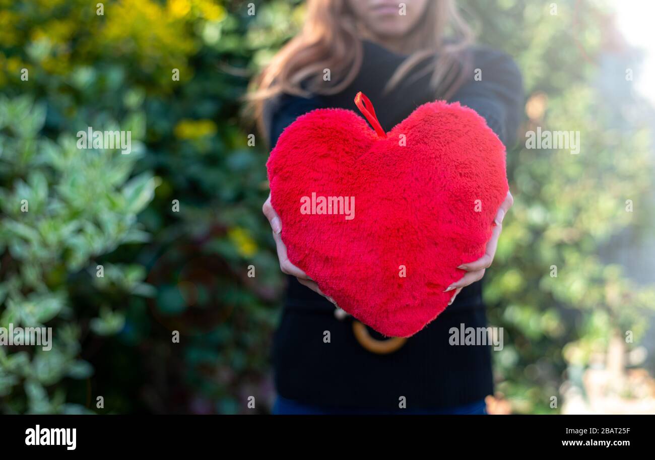 Hand offering heart symbol hi-res stock photography and images - Alamy