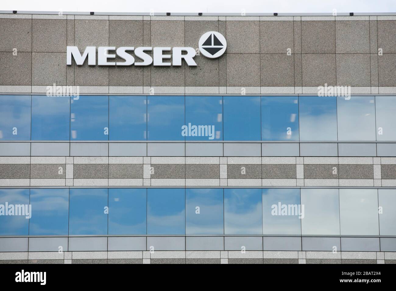 A logo sign outside of a facility occupied by The Messer Group in ...
