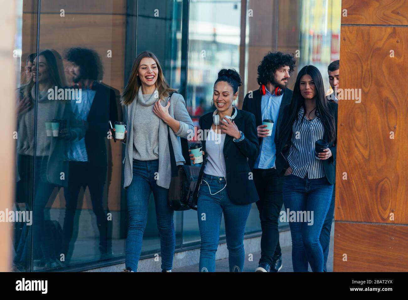 Group of colleagues on a business trip (euro trip) walking together at ...