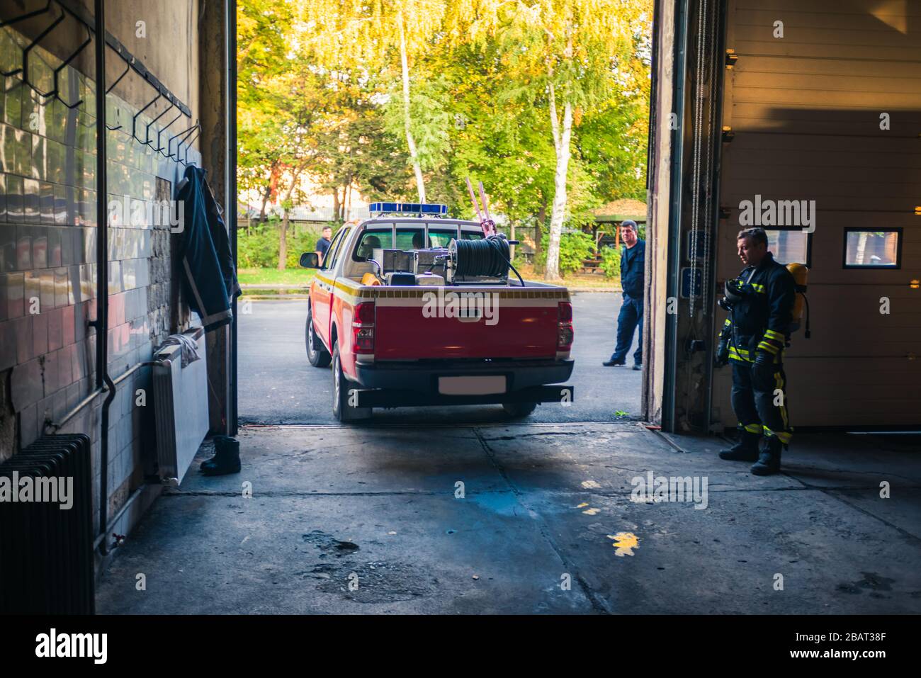 Fire engine truck leaving the garage of the fire department Stock Photo ...