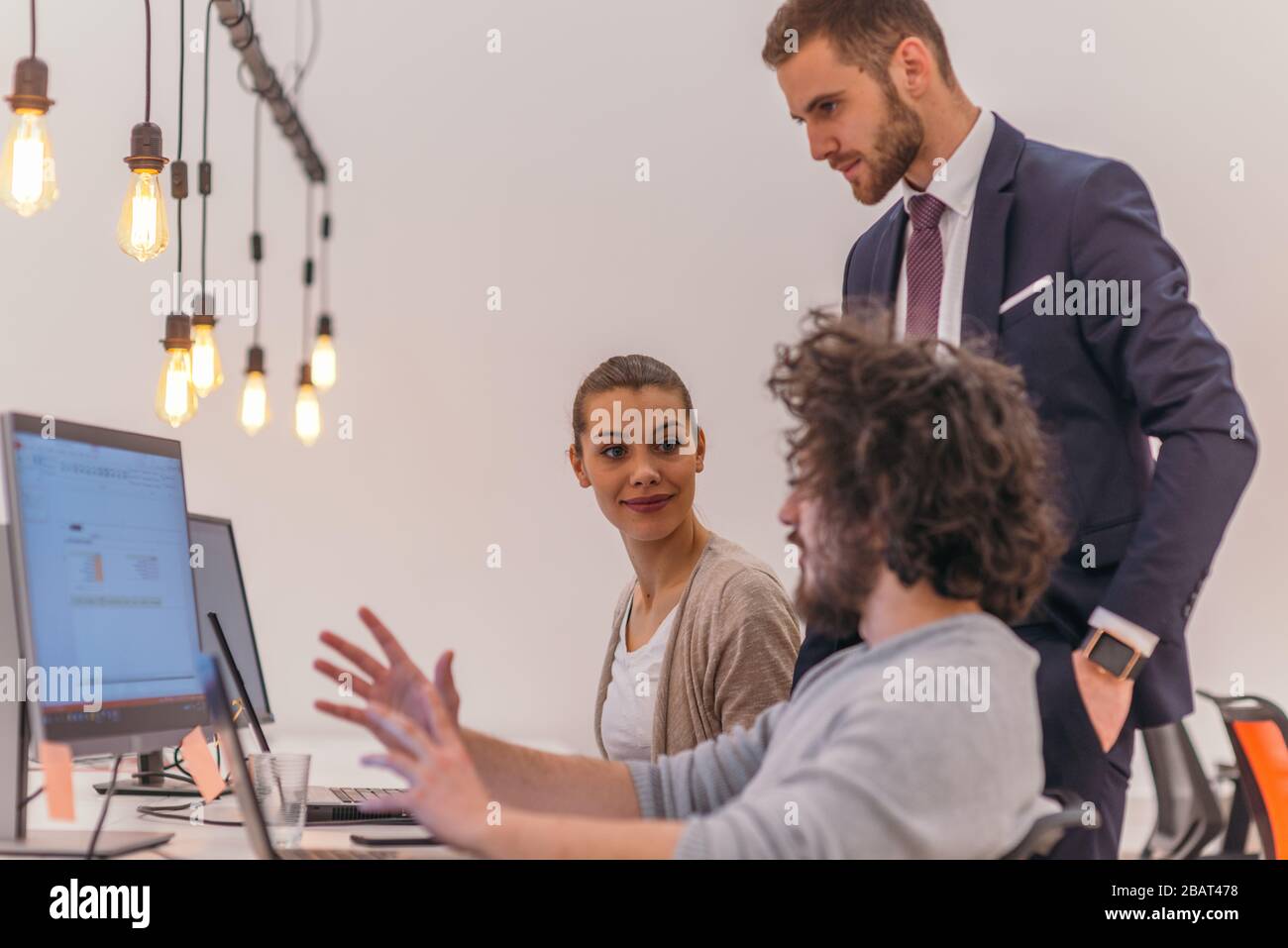 Manager overseeing his employees beautiful blonde and a coworker with ...