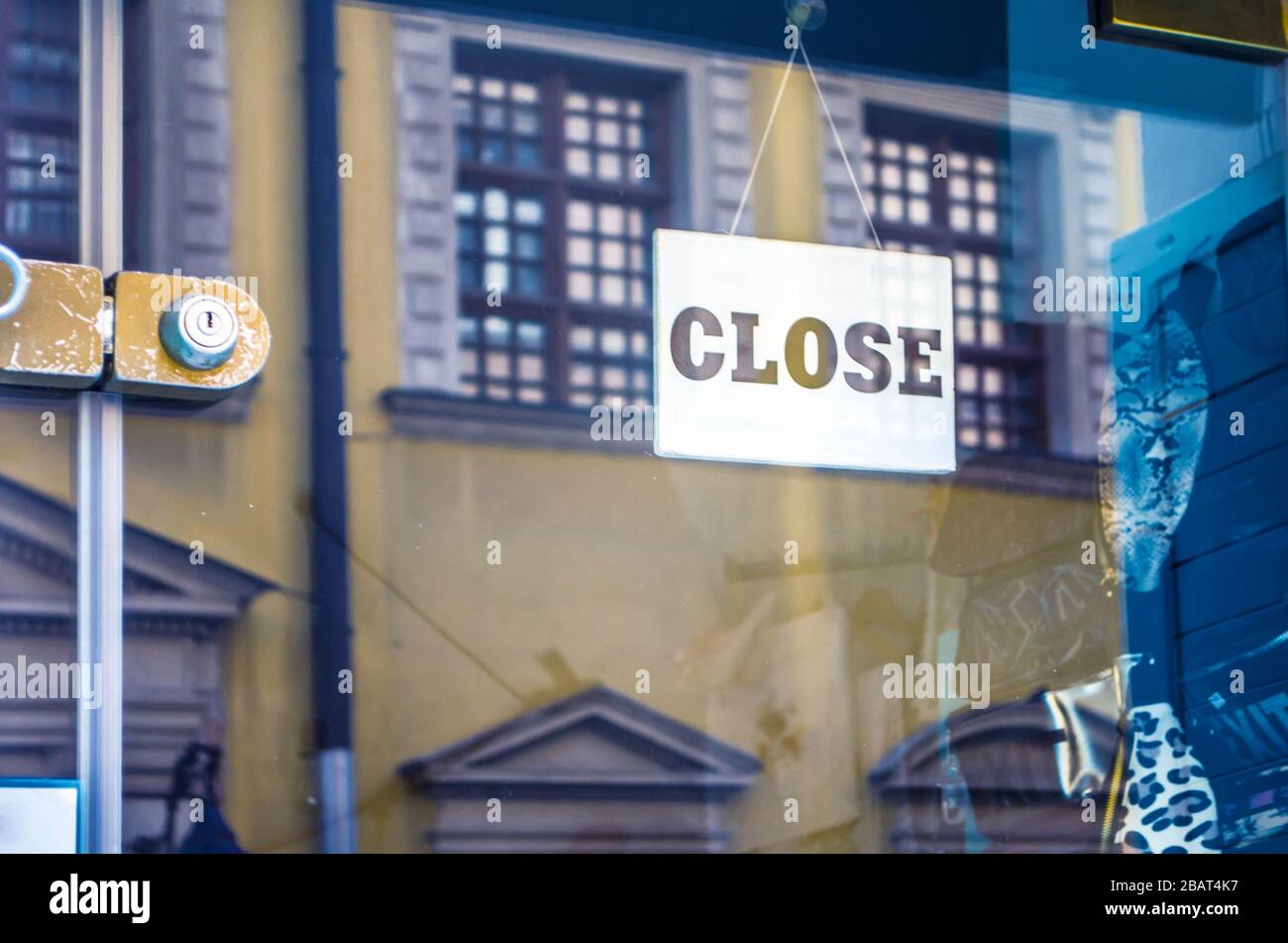 The sign CLOSE on the window of the city store. Quarantine closure of ...