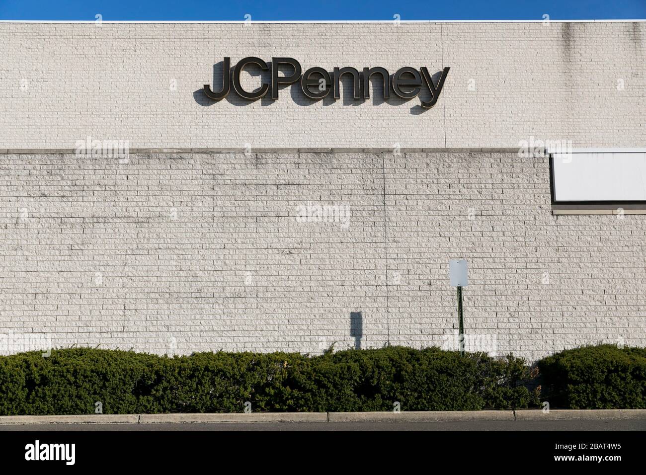 A logo sign outside of a JCPenney retail store location in North Wales ...