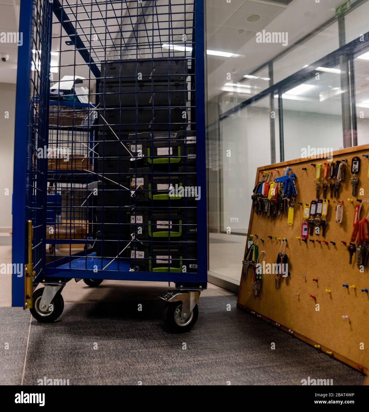 Metal cage with cash boxes stacked one on top of other at the treasury ...