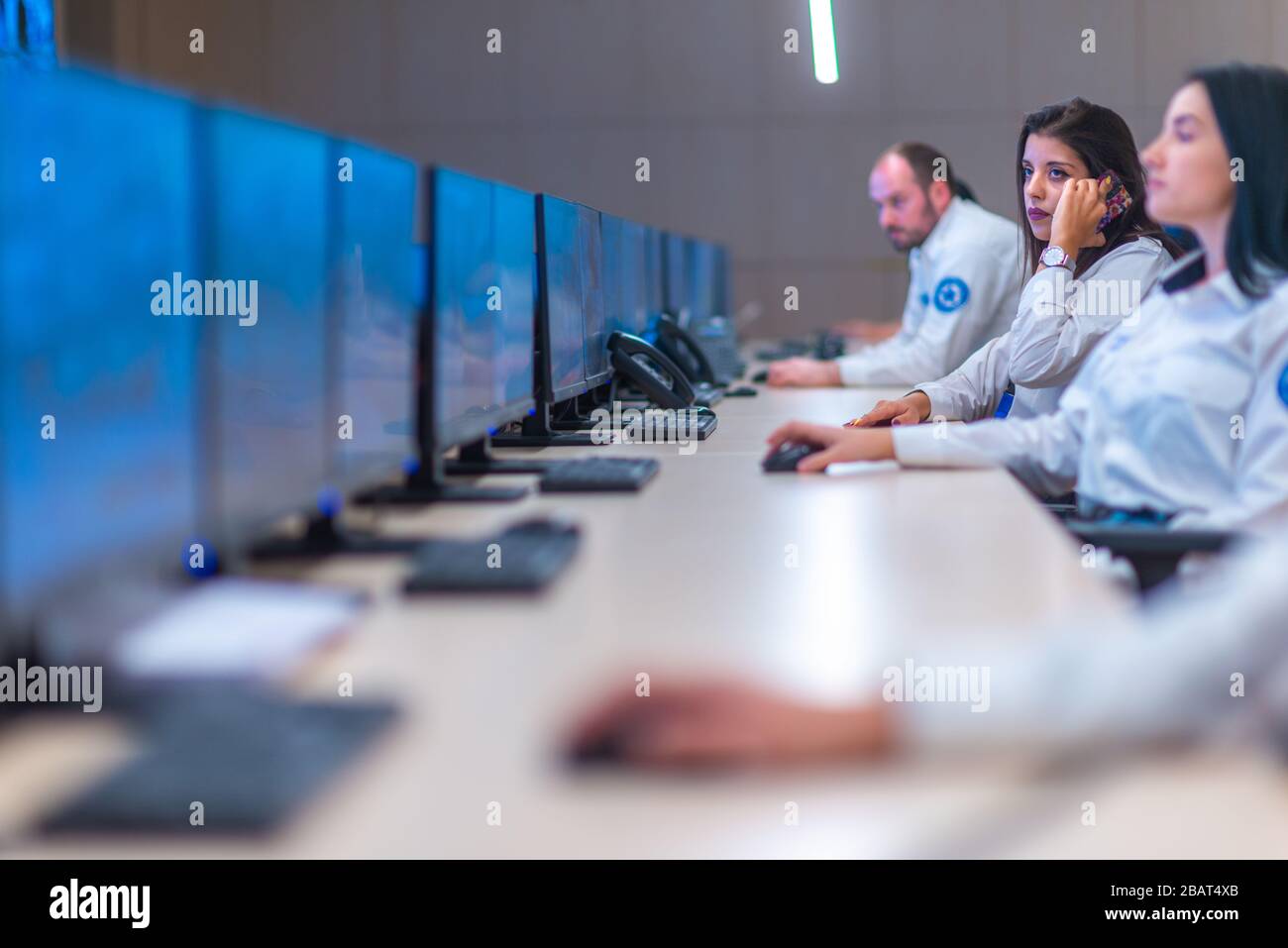 Group of Security data center operators (administrators) working in a ...