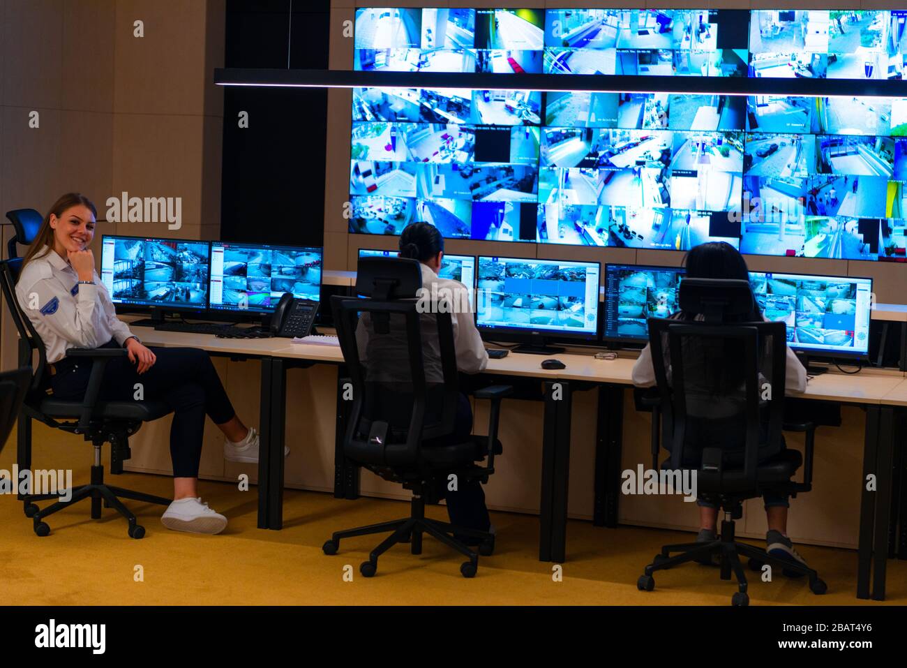 Team of secret agents in uniforms, monitoring cyber, video and ...