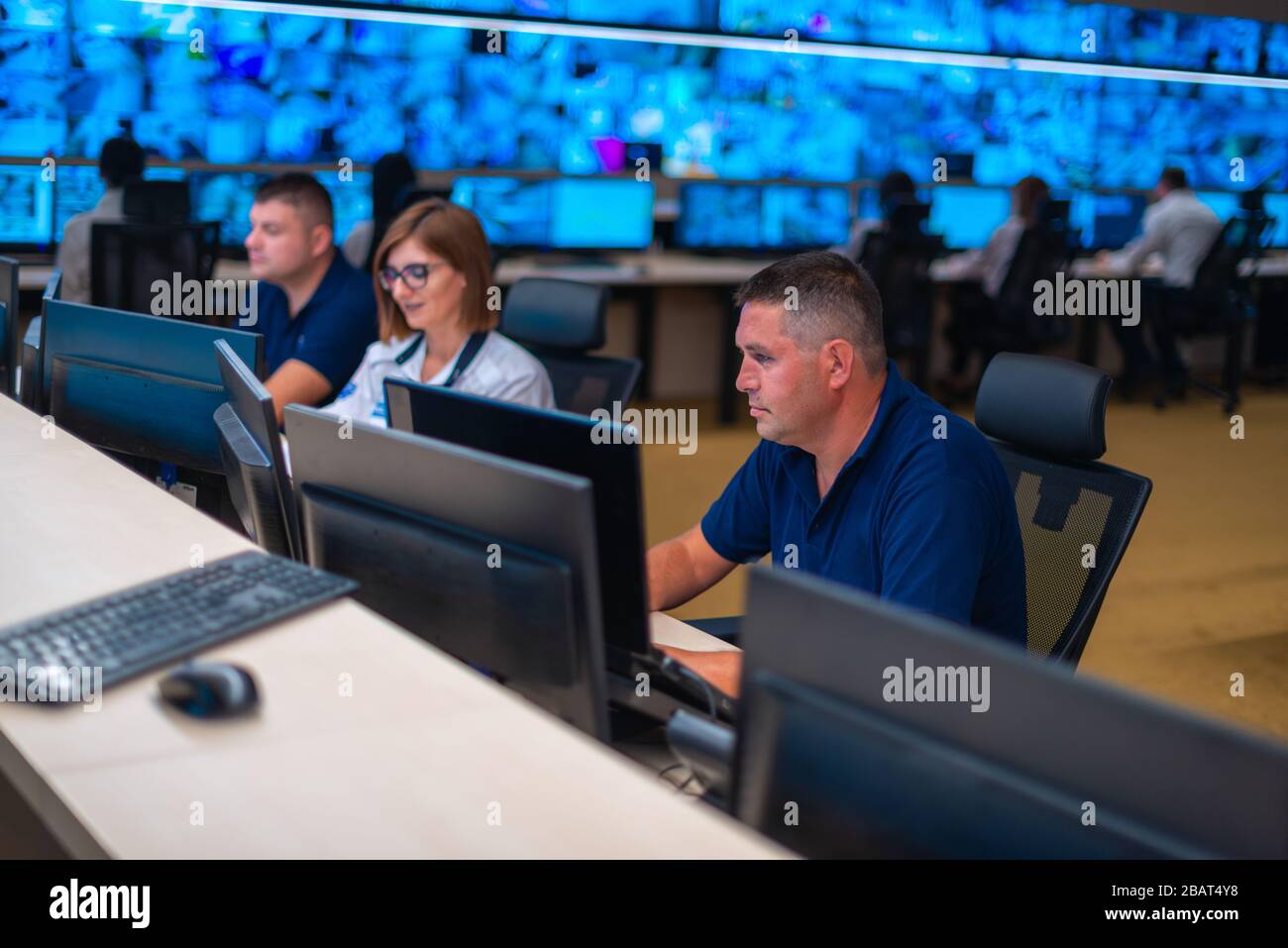 Group of Security data center operators (administrators) working in a ...