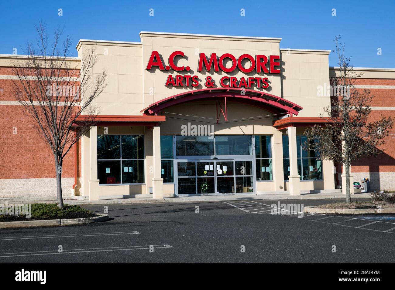 A logo sign outside of a A.C. Moore retail store location in North ...