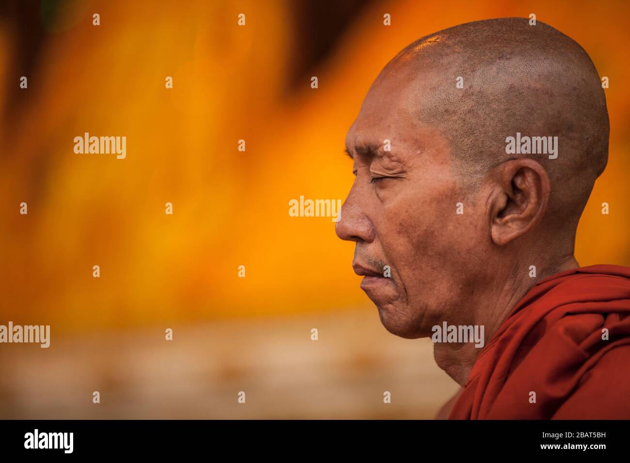Praying Monk. Yangon, Myanmar Stock Photo - Alamy