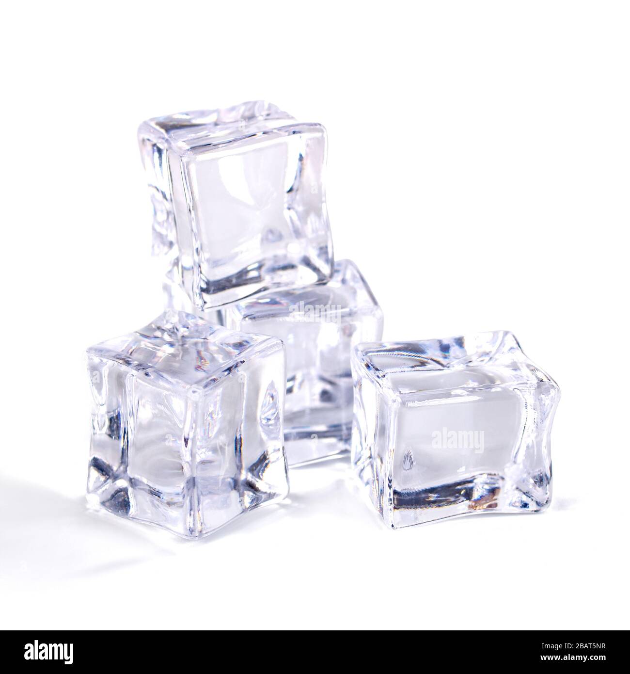 Pile of ice cubes isolated on white background Stock Photo - Alamy
