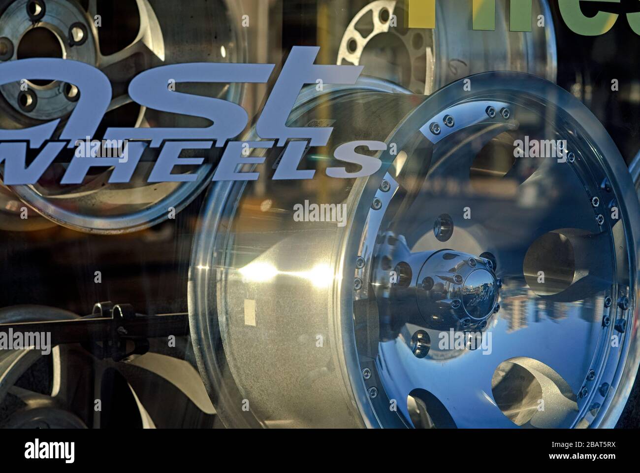 Steel alloy tire rims on display in a store window Stock Photo - Alamy