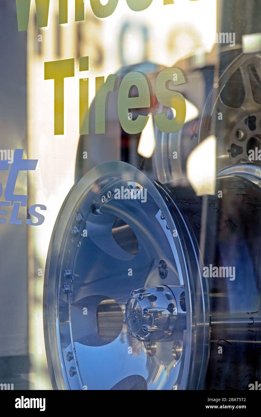 Steel alloy tire rims on display in a store window Stock Photo - Alamy