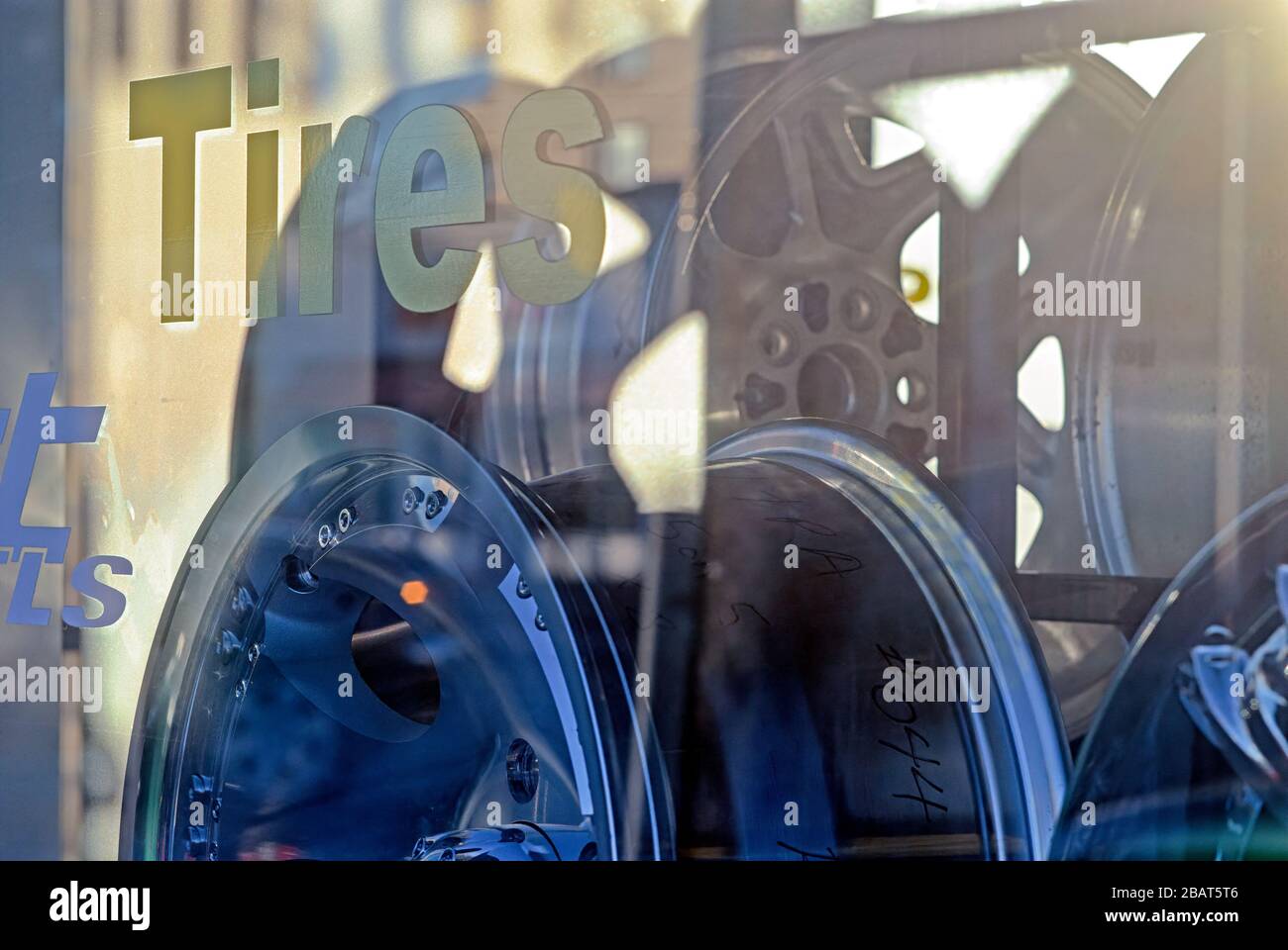 Steel alloy tire rims on display in a store window Stock Photo - Alamy