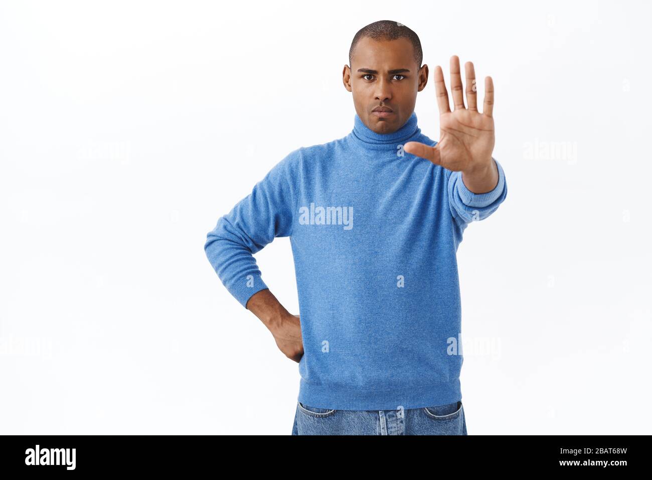 Portrait of confident, serious-looking young man warning as security ...