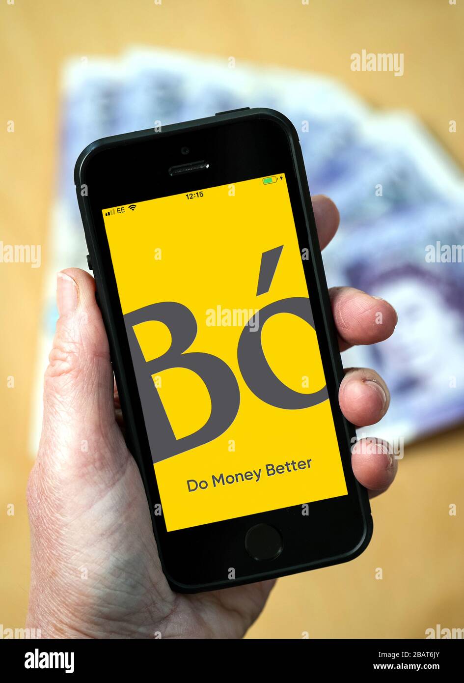 A woman using the Bo banking app on a mobile phone. (Editorial Use Only ...