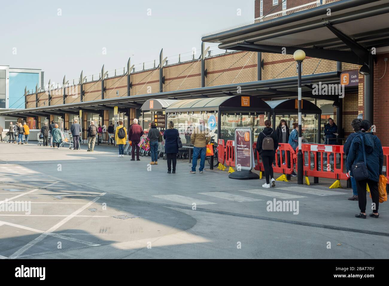 QUEUE TO THE SUPERMARKET WITH SOCIAL DISTANCING Stock Photo - Alamy