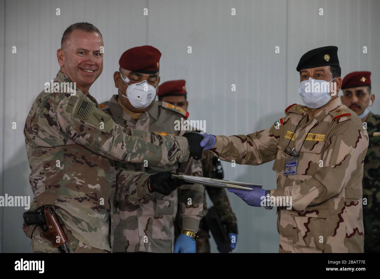 Kirkuk, Iraq. 29th Mar, 2020. US Brigadier General Vincent B. Barker (L ...