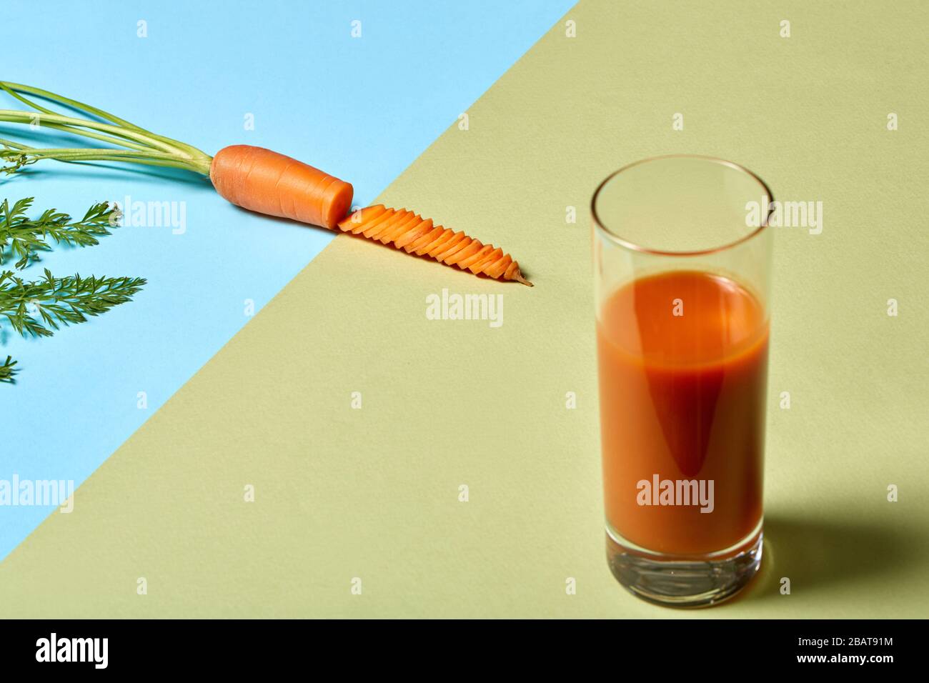 Healthy Lifestyle. Cutted carrot isolated on blue and bage ingredient ...