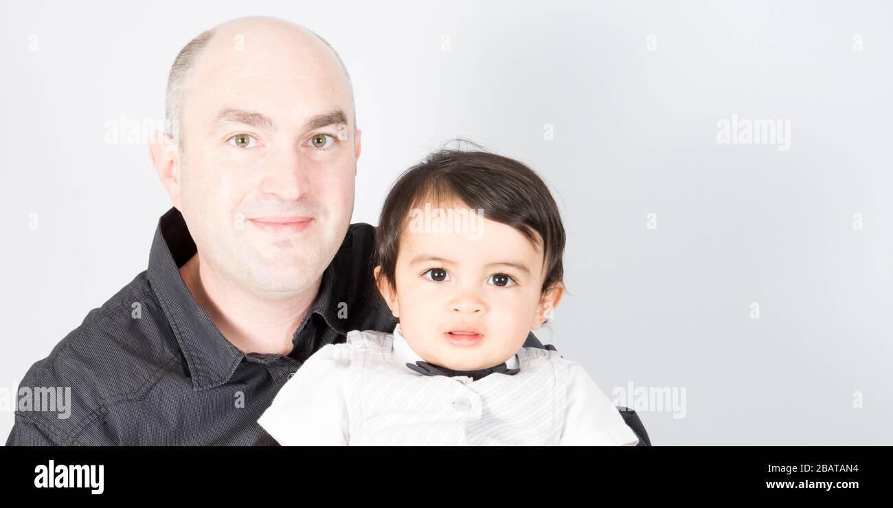 white bald man father with son boy child mixed race Stock Photo - Alamy