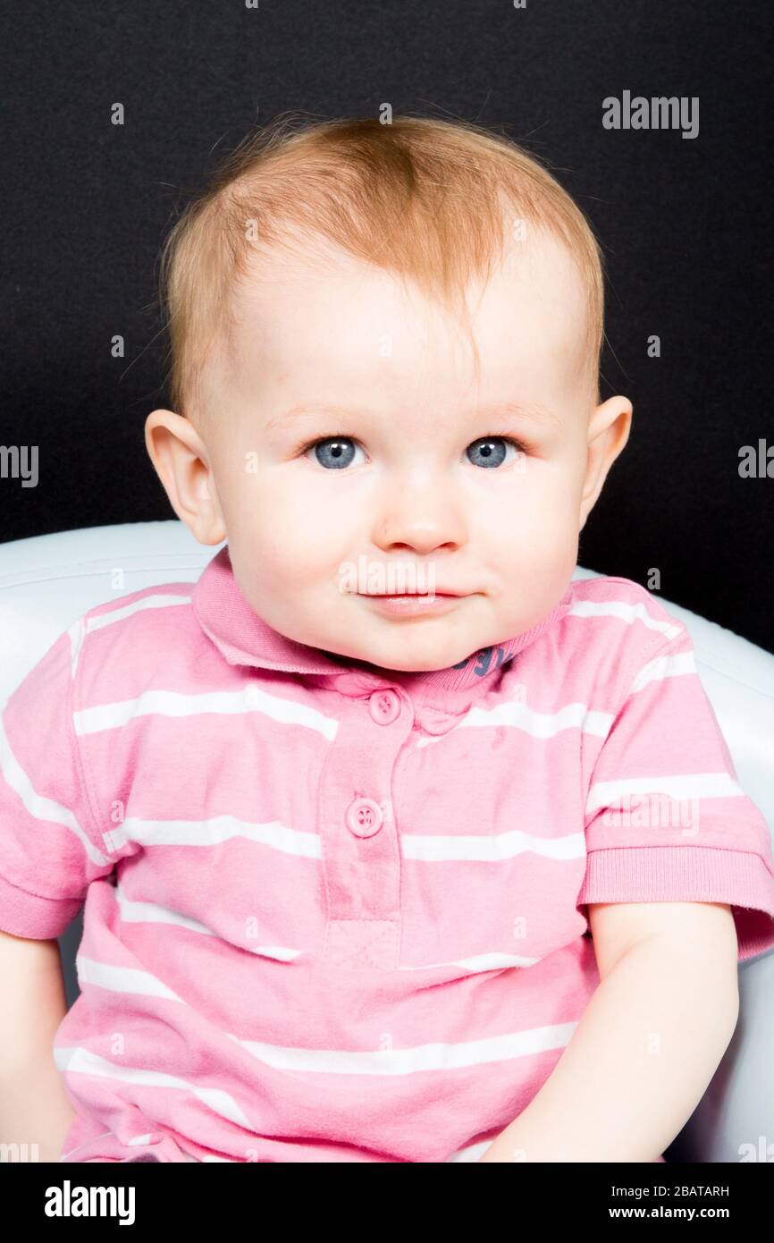 Portrait of child boy looking down Stock Photo - Alamy