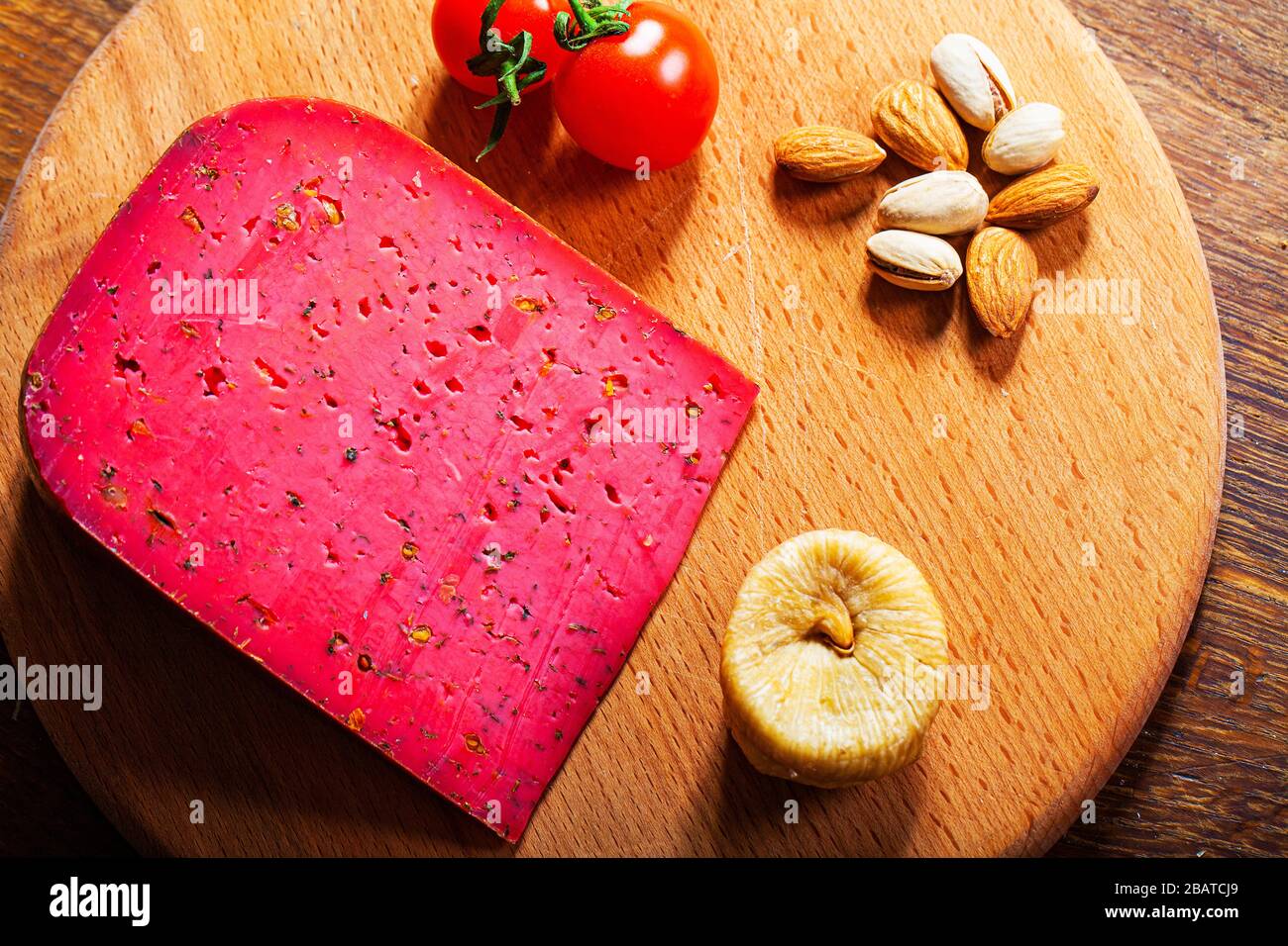 Chunk of red cheese on wooden background Stock Photo - Alamy