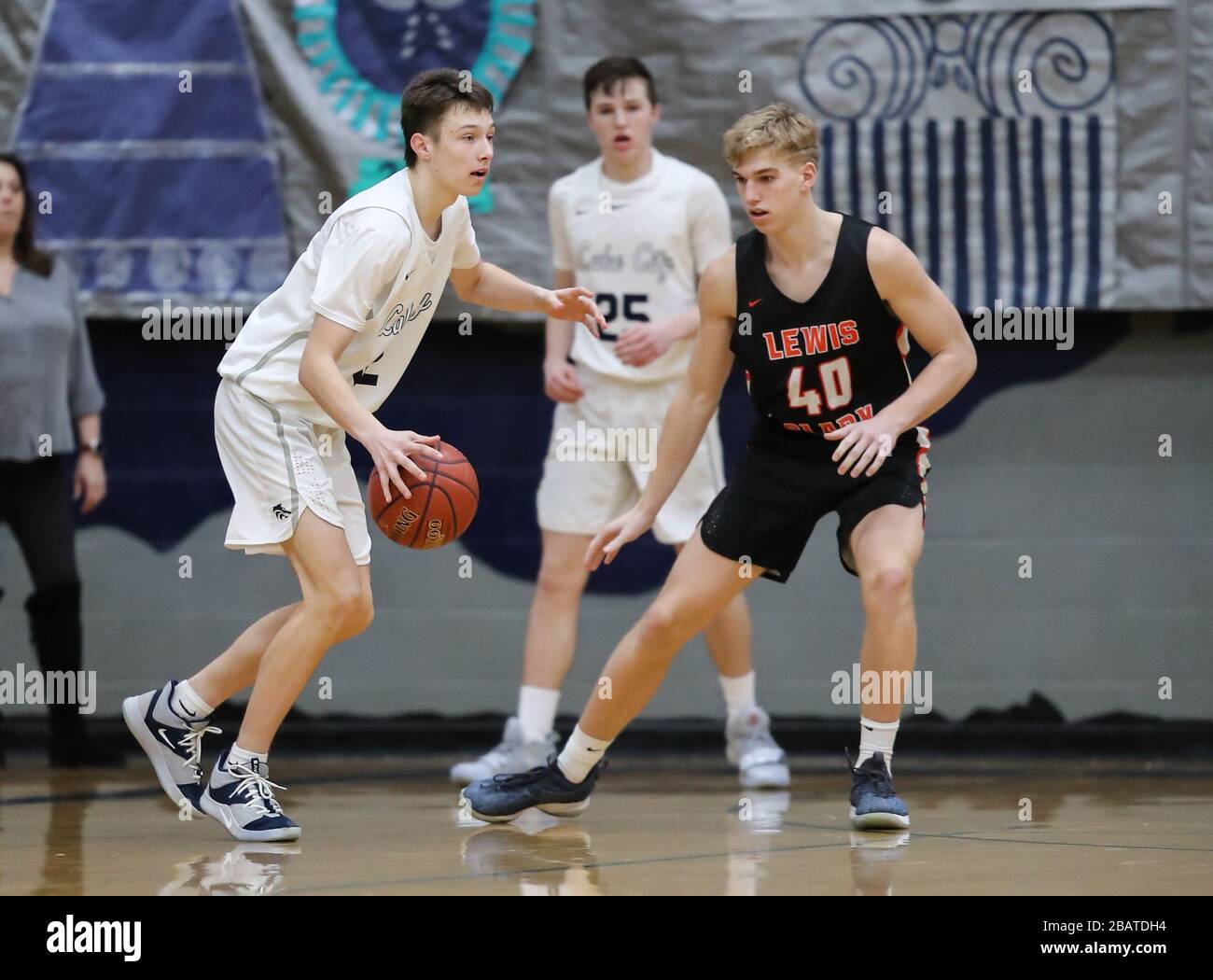 Basketball action with Lewis and Clark High School vs Lake City in ...