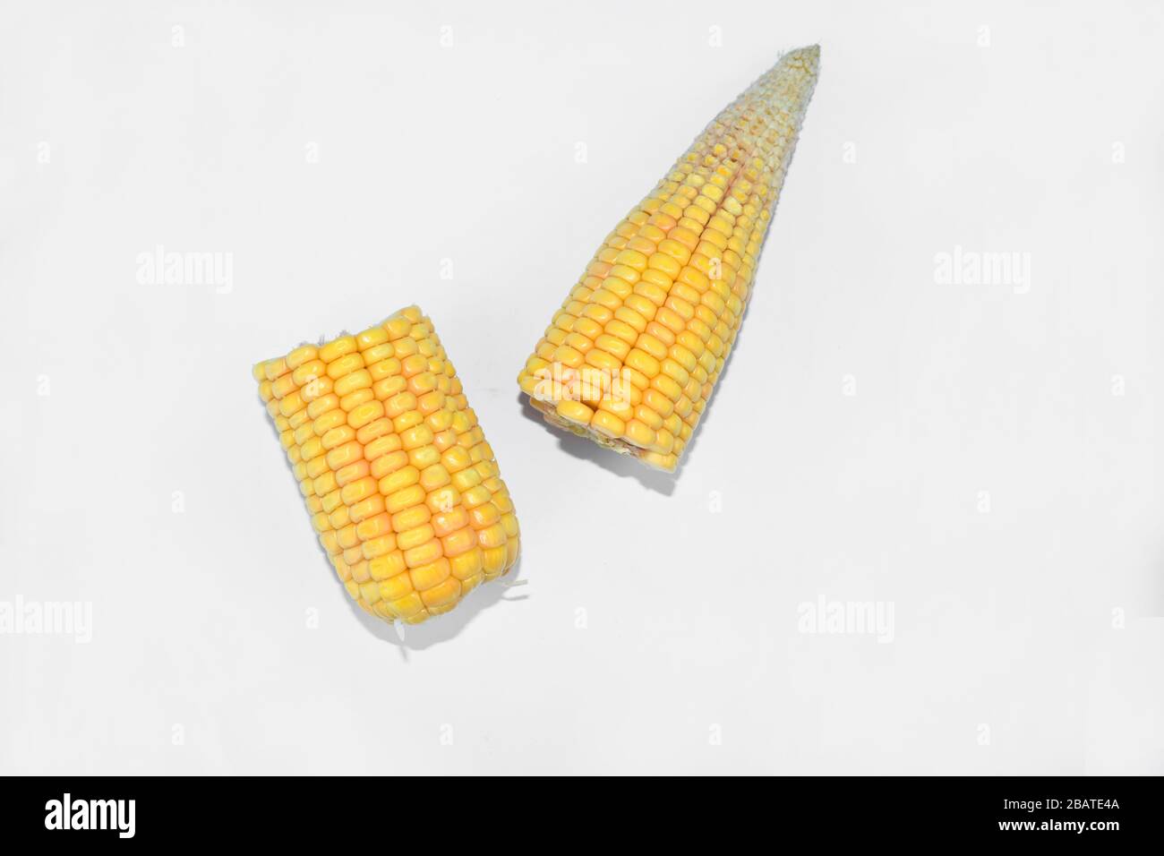 Top view of two half pieces of sweet yellow ear of corn isolated in a ...