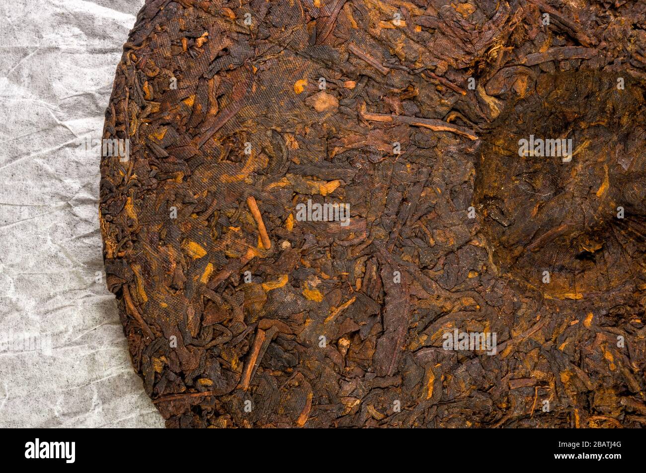 Chinese pressed PU-erh tea on wrapping paper, close-up, macro Stock ...