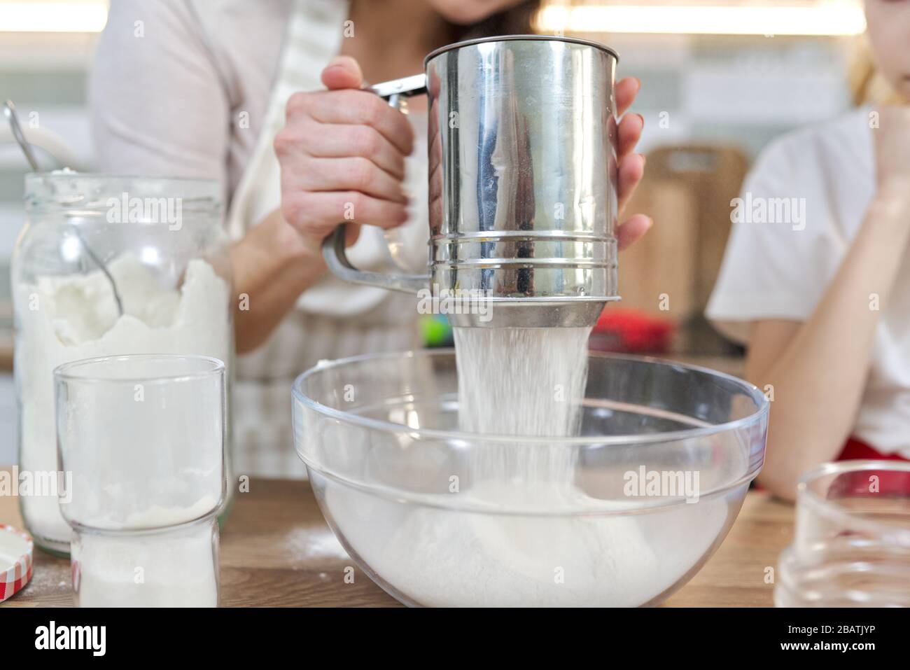 Sifting flour through metal sifter hi-res stock photography and images ...