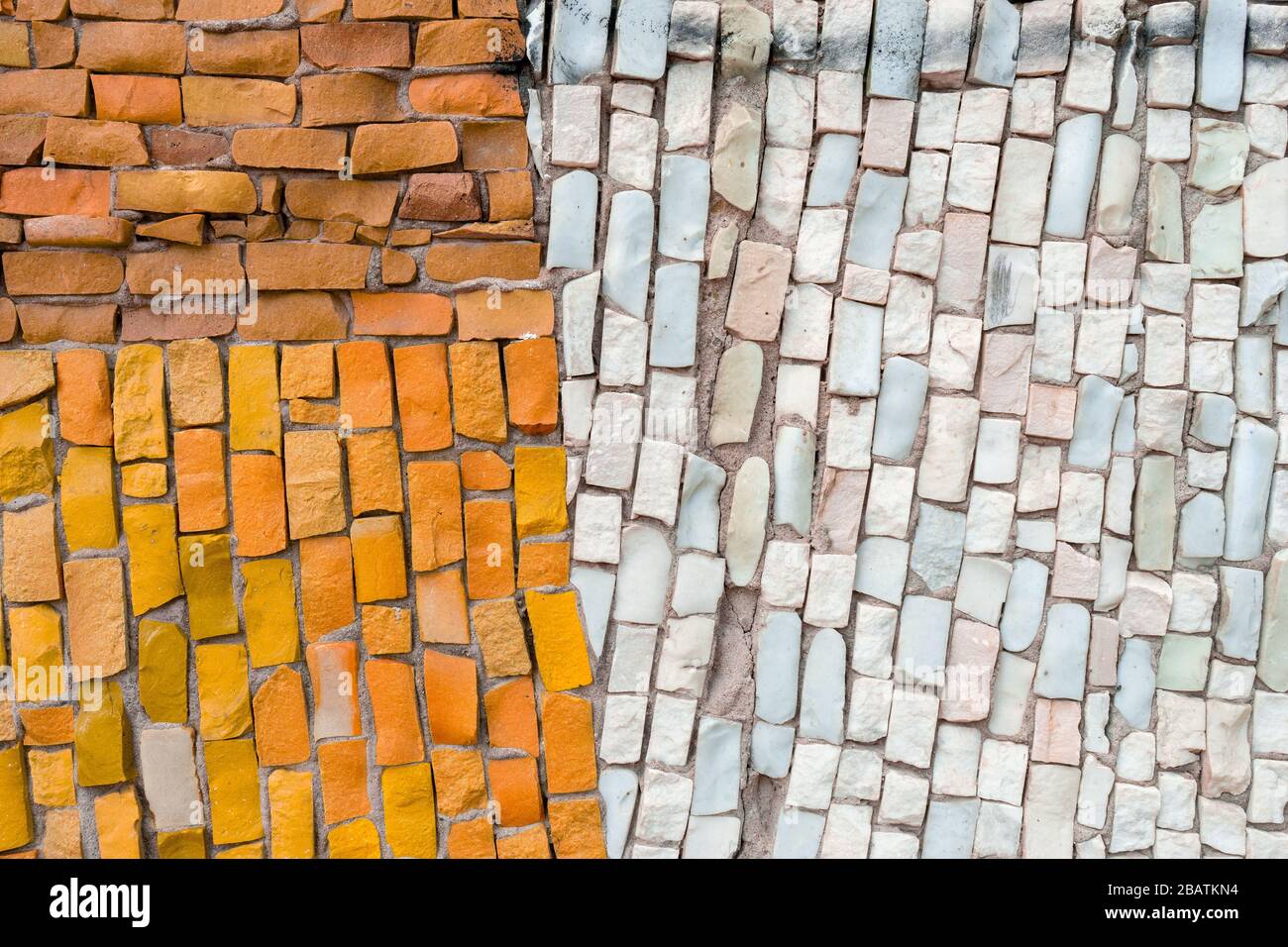 Surface of old crumbling abstract decorative mosaic with white, orange ...