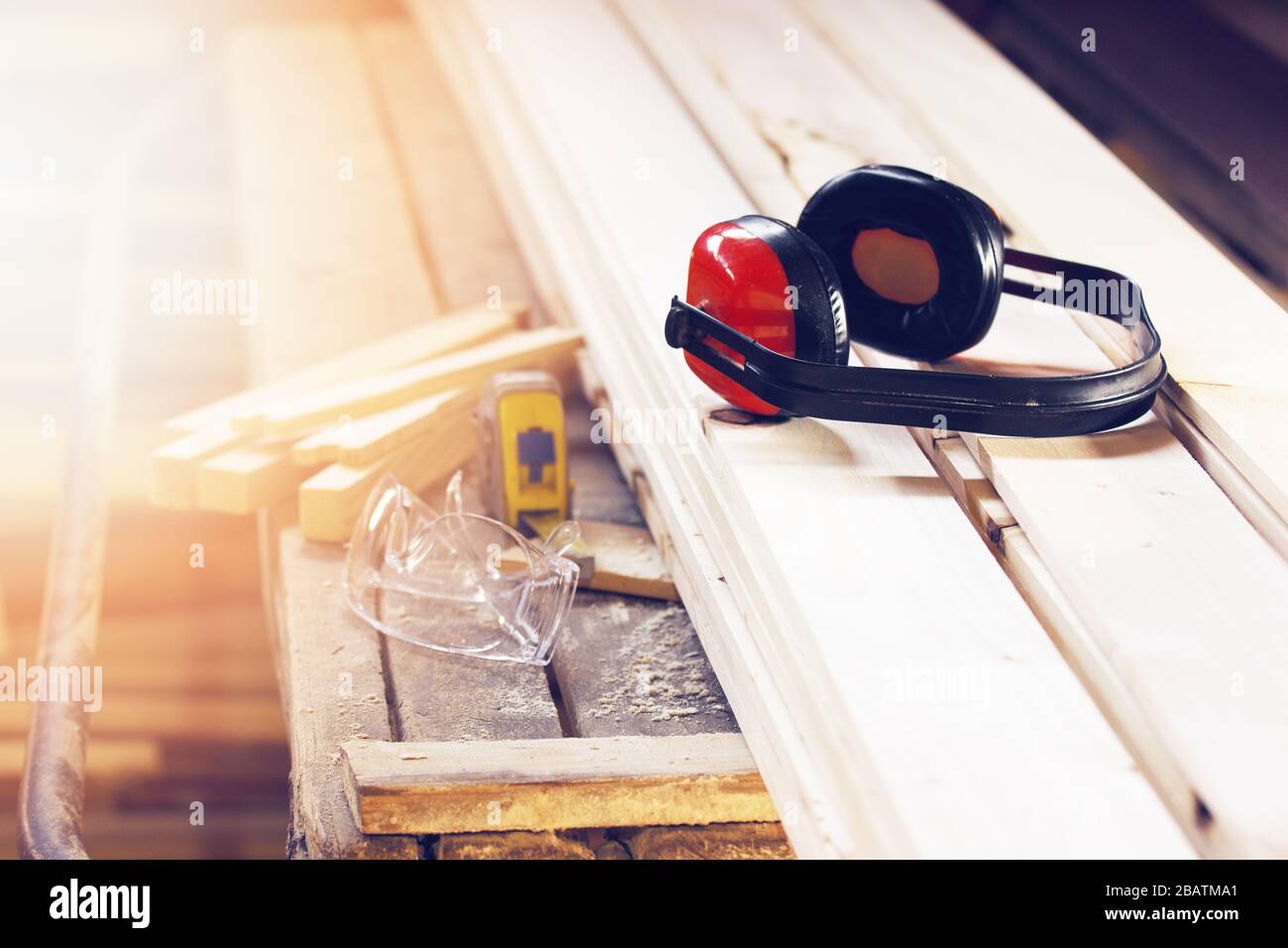 Workman at the sawmill. Young hardworking man Stock Photo - Alamy
