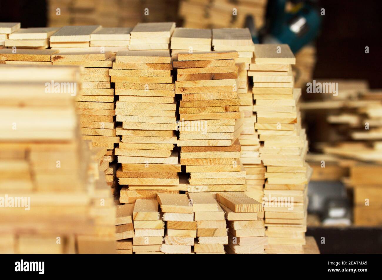Workman at the sawmill. Young hardworking man Stock Photo - Alamy